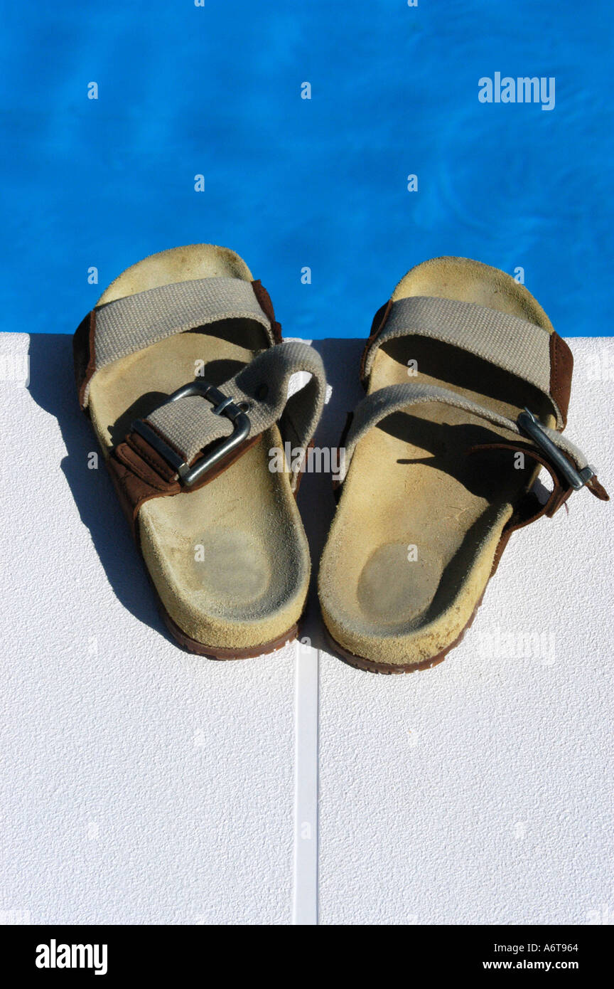 Sandals by the pool Stock Photo - Alamy