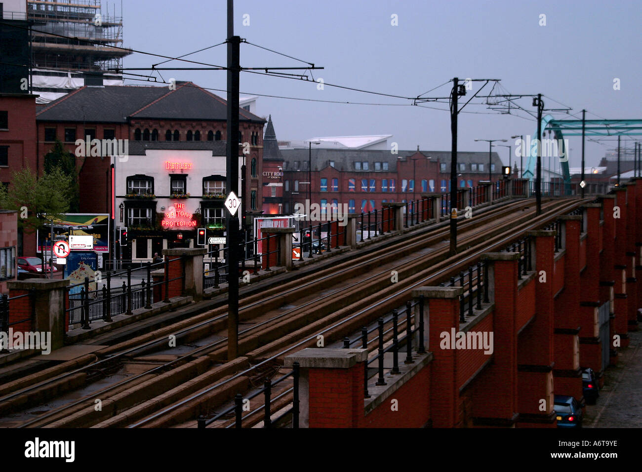 The elevated railway runs through the centre of Manchester Stock Photo ...