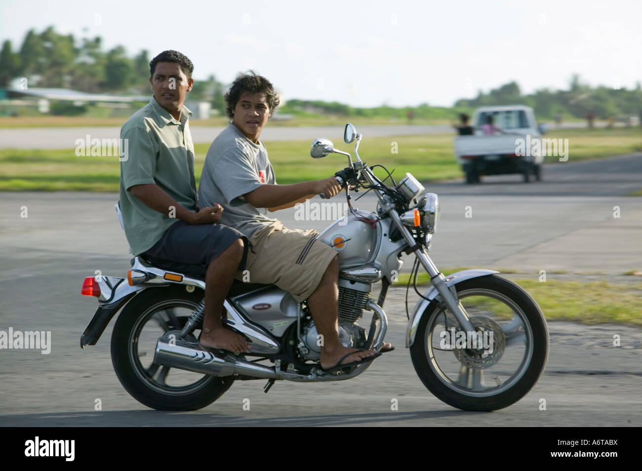 Tuvaluan men on a motorbike, Funafuti, tuvalu Stock Photo - Alamy