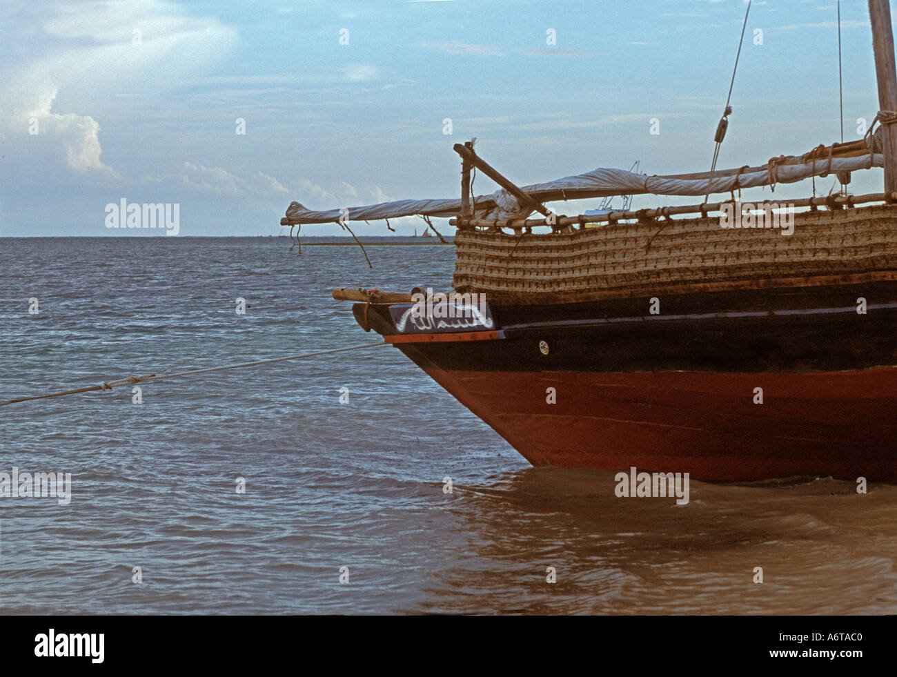 AFRICA, KENYA Mombasa Beach Traditional Arabic sailing dhow on the ...