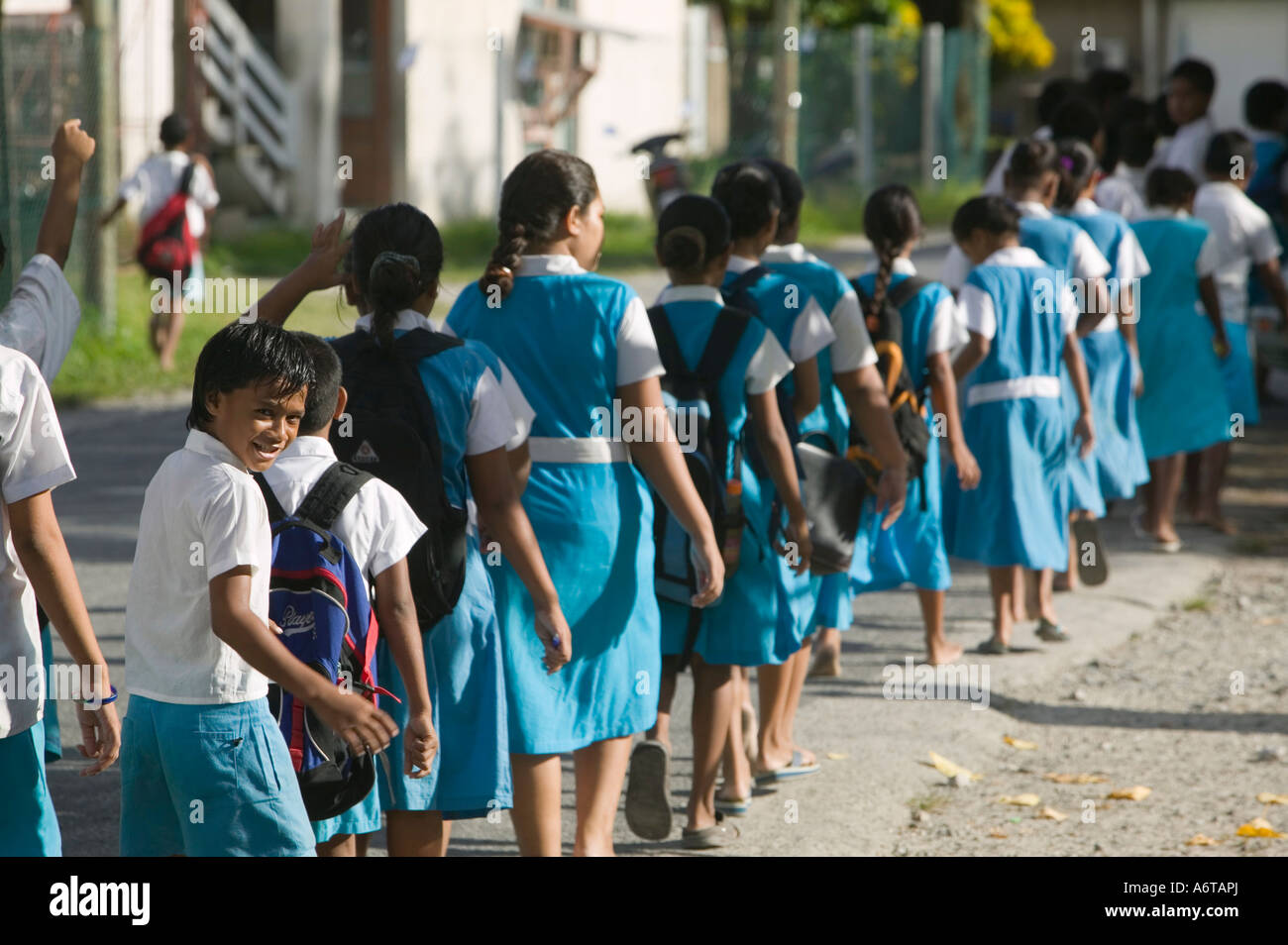 Children walking to school on funafuti, Tuvalu Stock Photo - Alamy