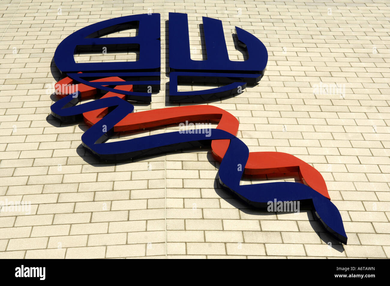BWFC logo red blue brick wall bolton wanderers football club stadium ...