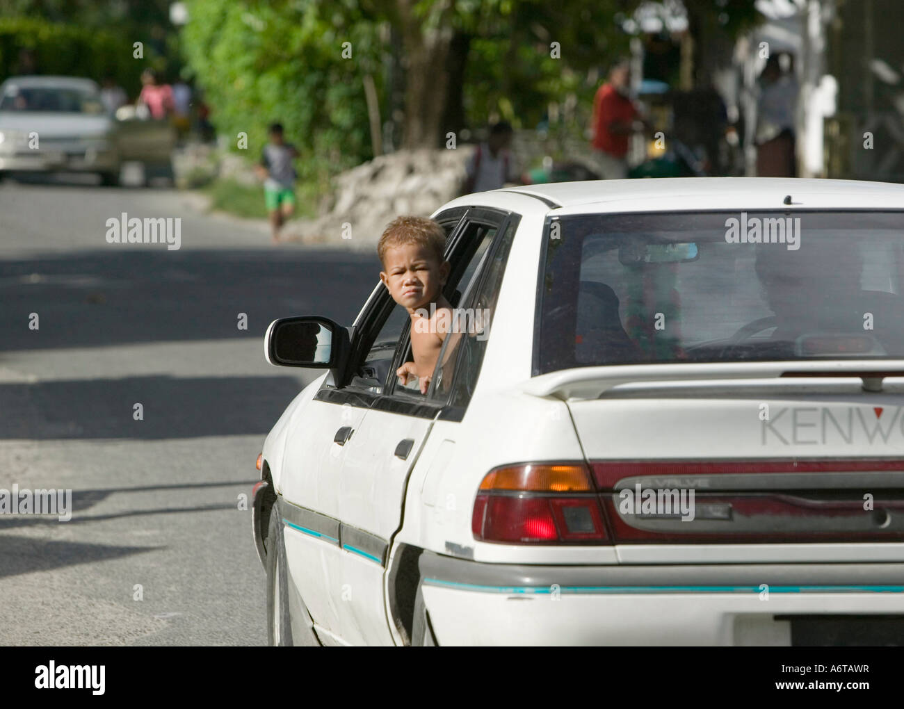 a child leaning out of a car window on Funafuti, Tuvalu Stock Photo - Alamy
