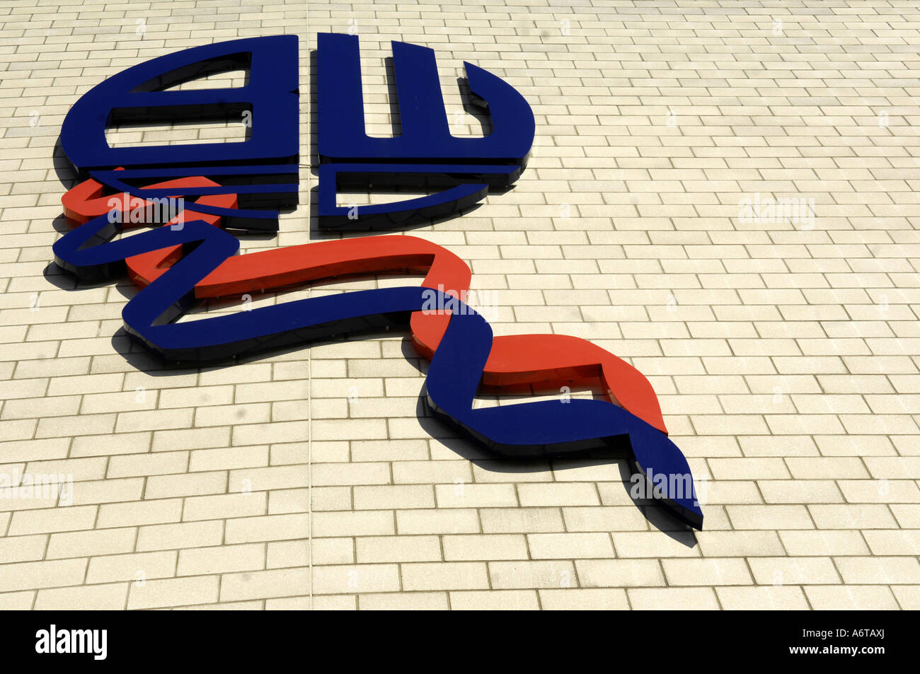 BWFC logo red blue brick wall bolton wanderers football club stadium ...