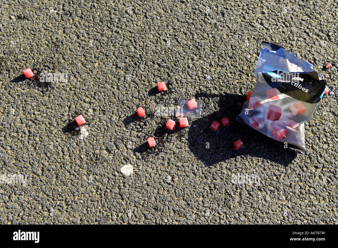 sweets packet torn thrown away discarded litter floor ground ripped ...