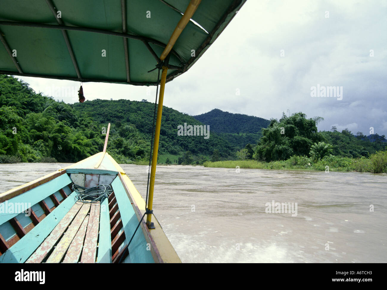 View from long-tail boat on Mae Nam Kok river travelling between Chiang ...
