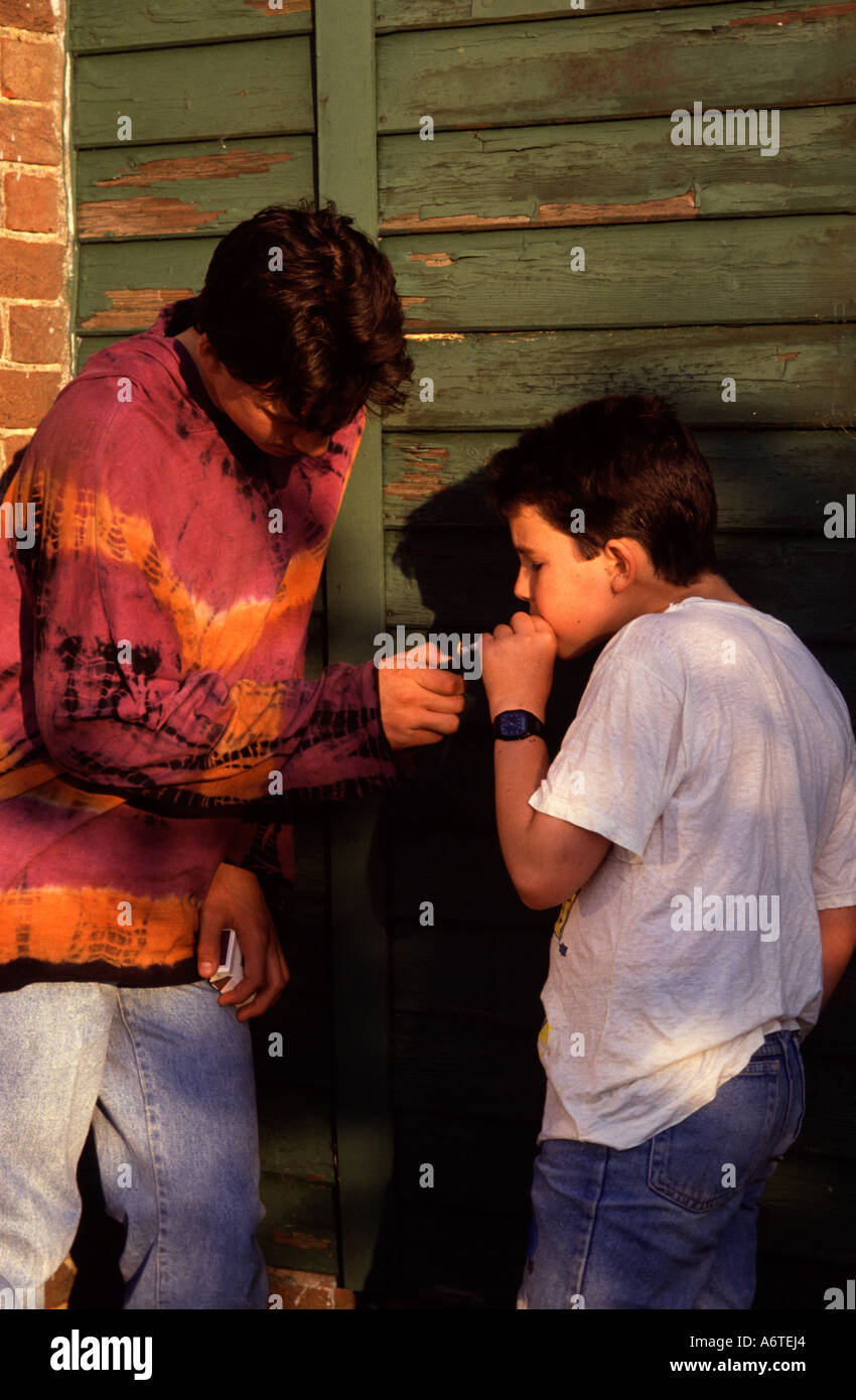 Two teenage boys smoking a cigarette Stock Photo: 6654627 - Alamy