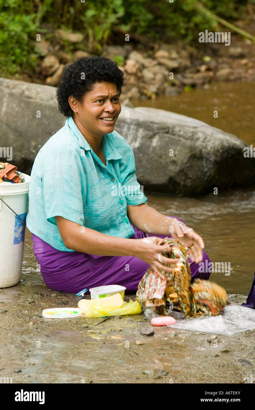 Women washing clothes in a stream hi-res stock photography and images ...