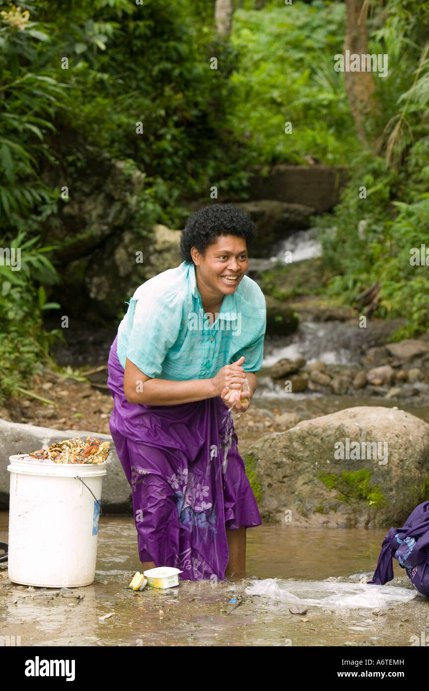 Woman is washing laundry in stream hi-res stock photography and images ...