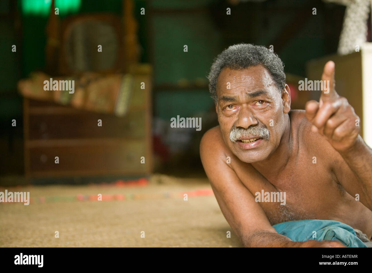 A Fijian man in his hut in Bukaya village, Fijian Highlands Stock Photo ...