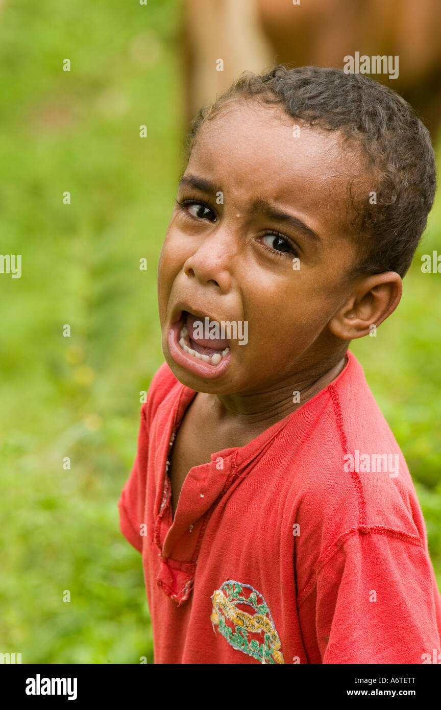 A young Fijian boy crying in Bukaya village, Fiji Stock Photo - Alamy