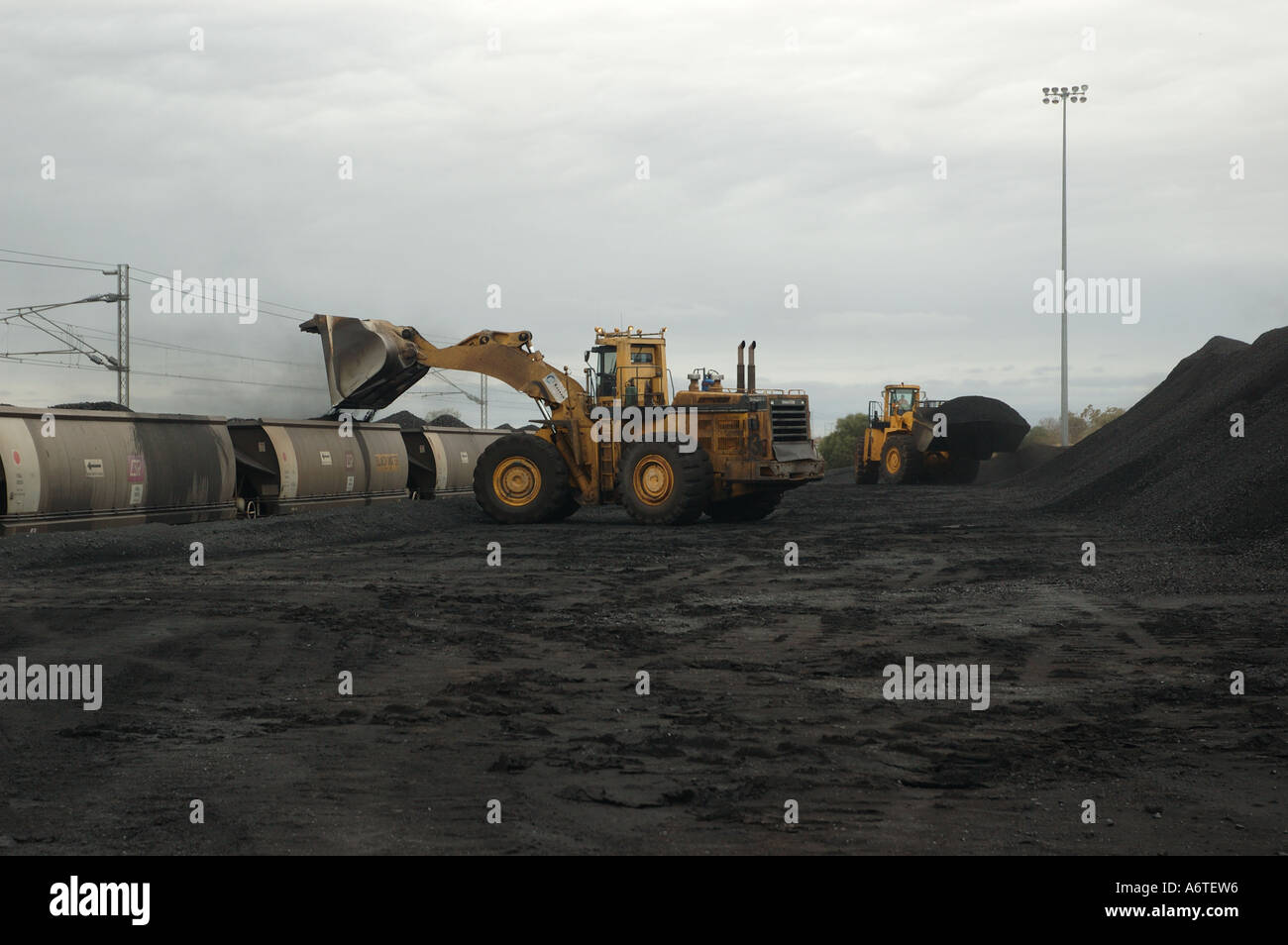 front end loader and coal train Central Queensland mine Stock Photo - Alamy