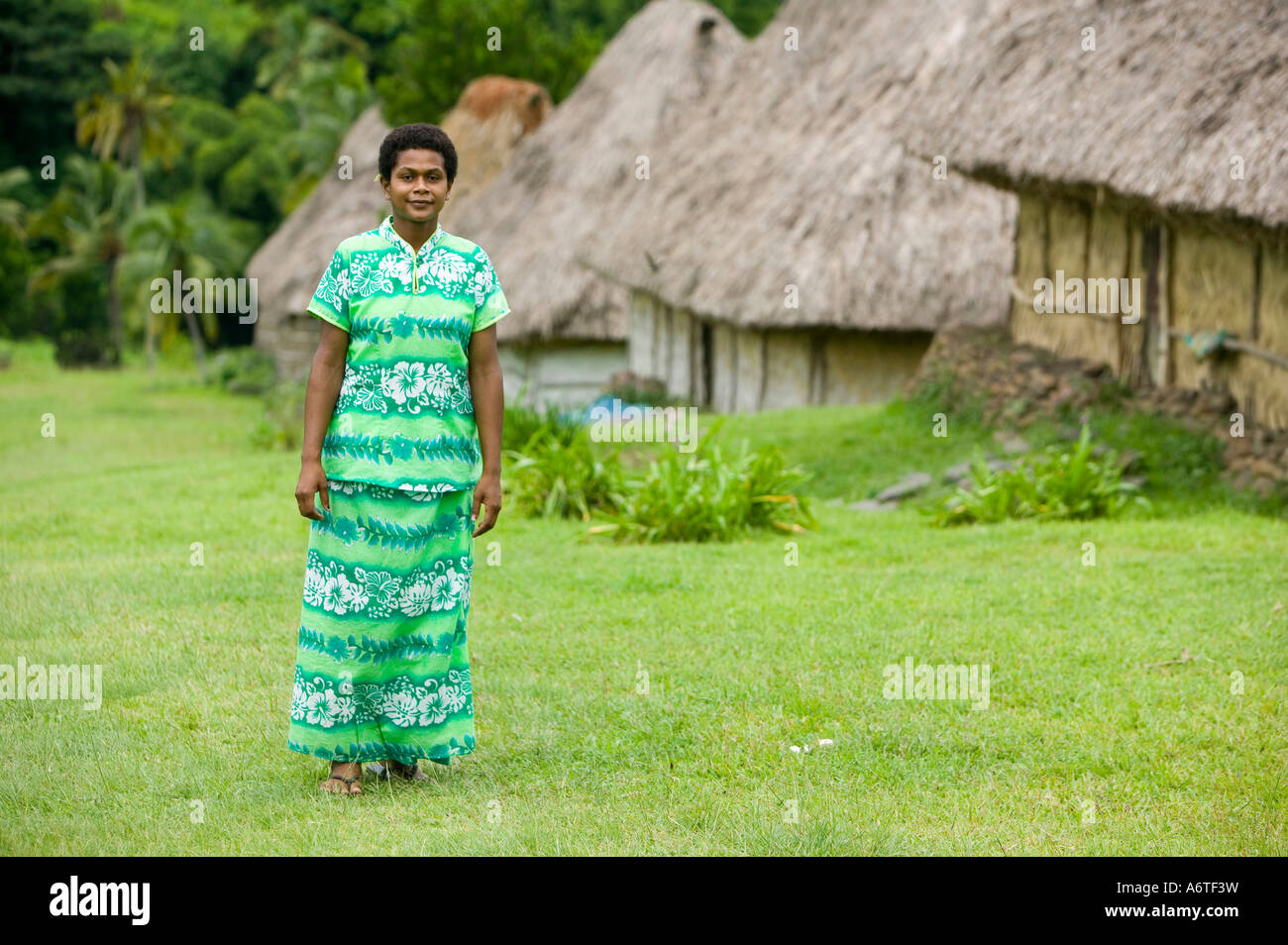 A women strolling through, Navala Village, Fiji, the only village left ...