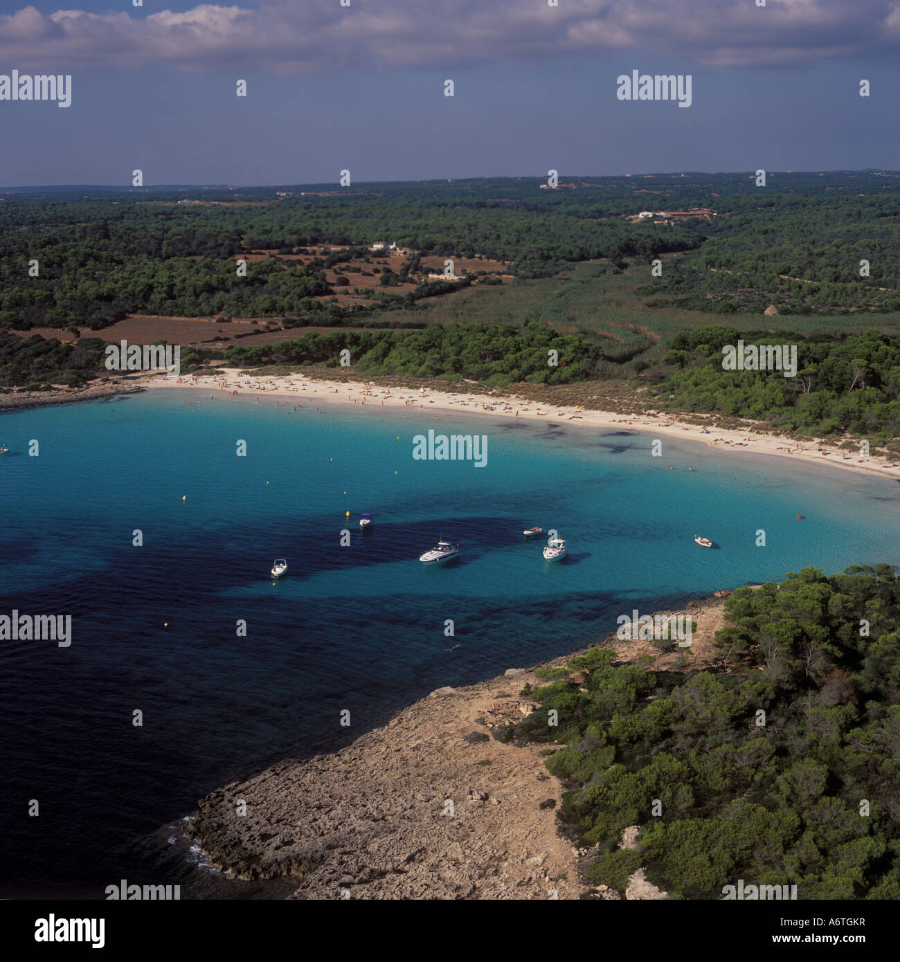Aerial view - large remote cala / bay with long sandy beach and leisure ...