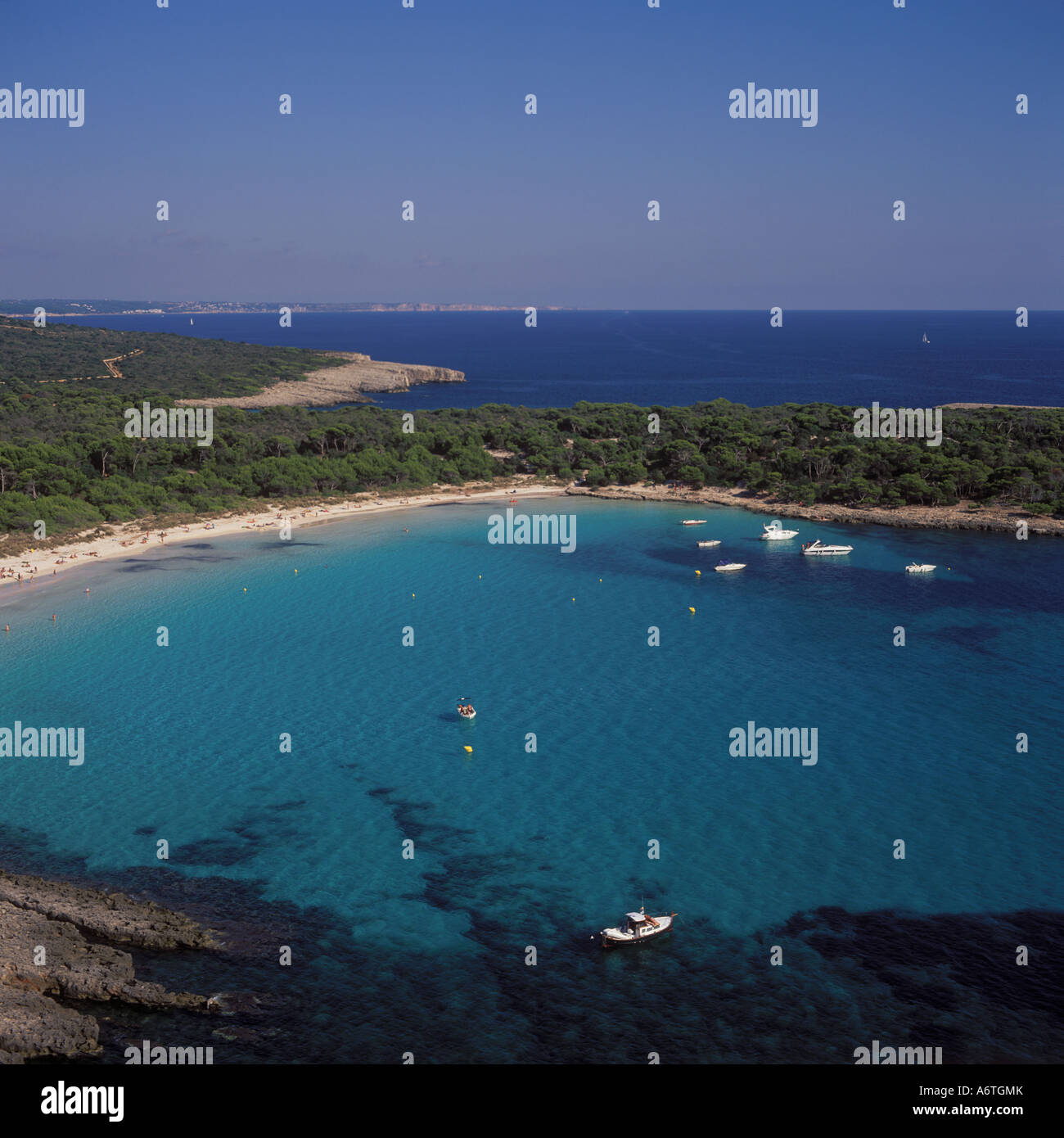 Aerial view looking East - large remote cala / bay with long sandy ...