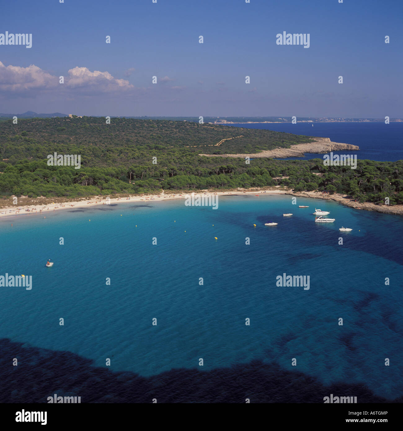 Aerial view - large remote cala / bay with long sandy beach and leisure ...