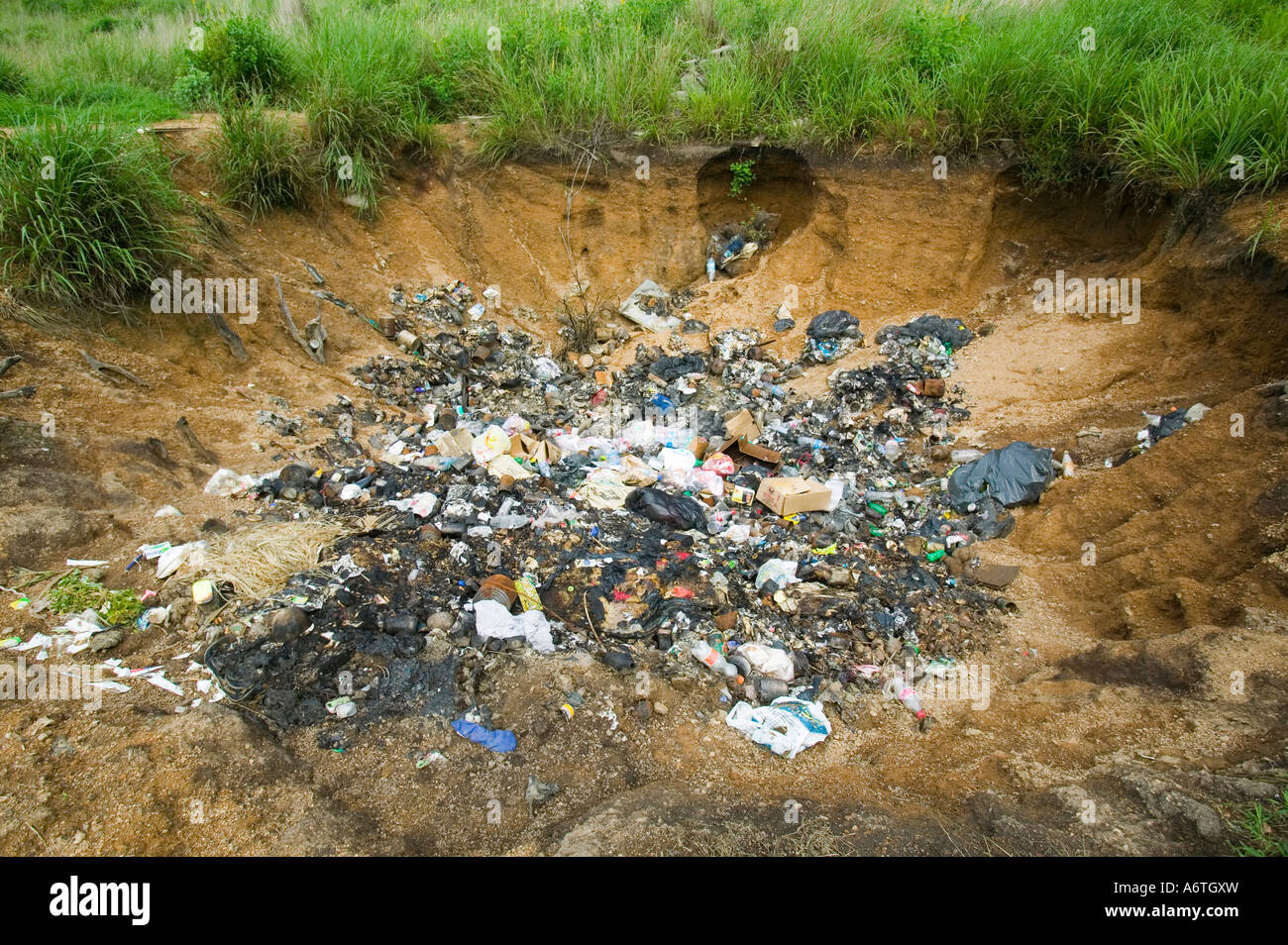 Rubbish pit behind Walu Beach resort, Malolo island, Mananucas, Fiji ...