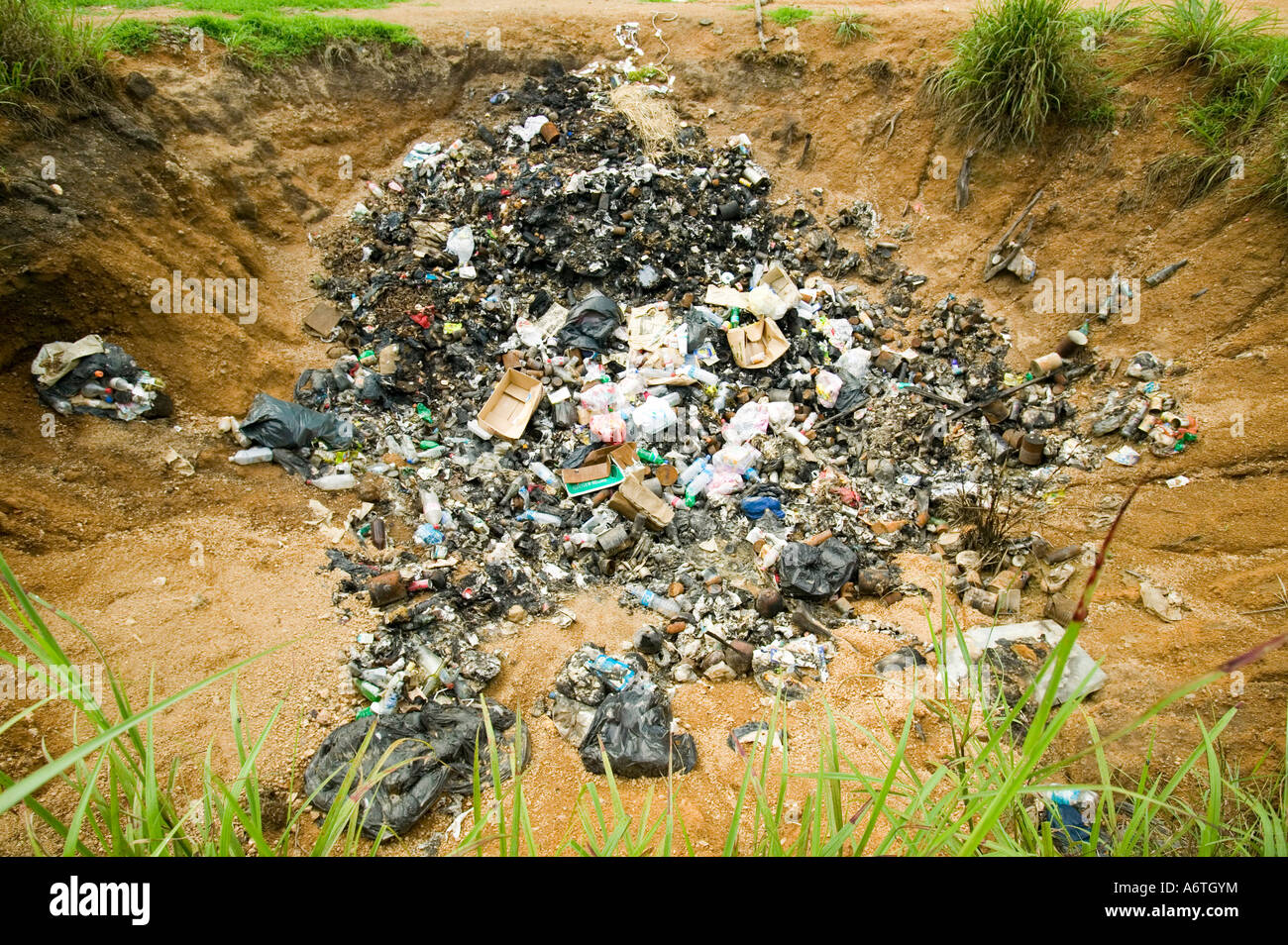 Rubbish pit behind Walu Beach resort, Malolo island, Mananucas, Fiji ...