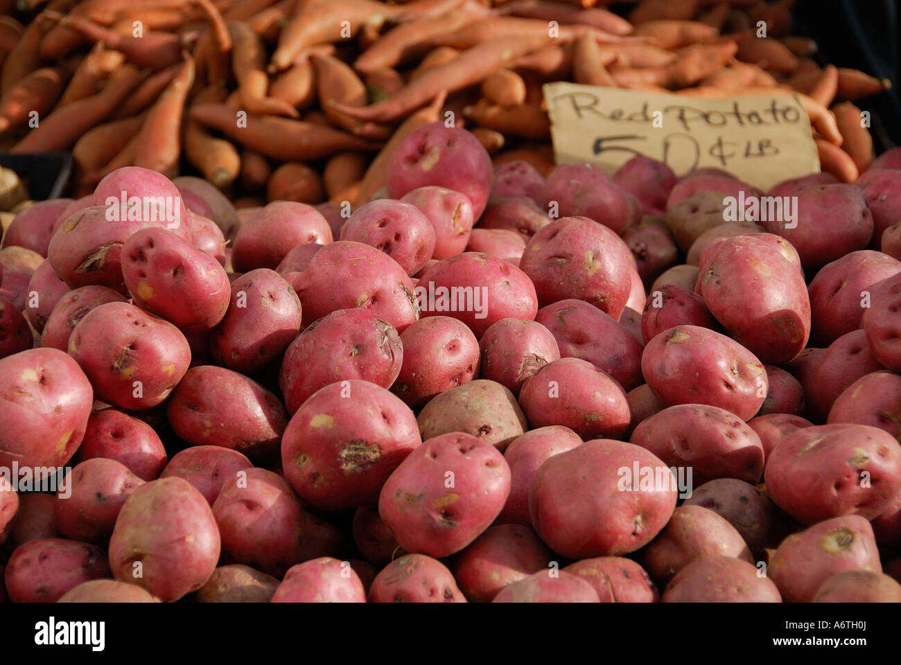 "Pile of "Red potatoes", "50¢ lb" "price sign", "farmers' market ...