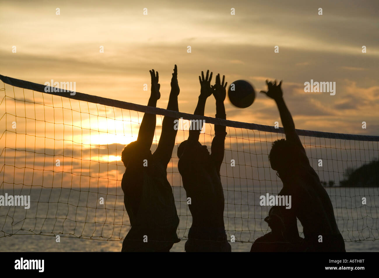 Fijians playing beach volleyball at Walu Beach resort on Malolo Island ...
