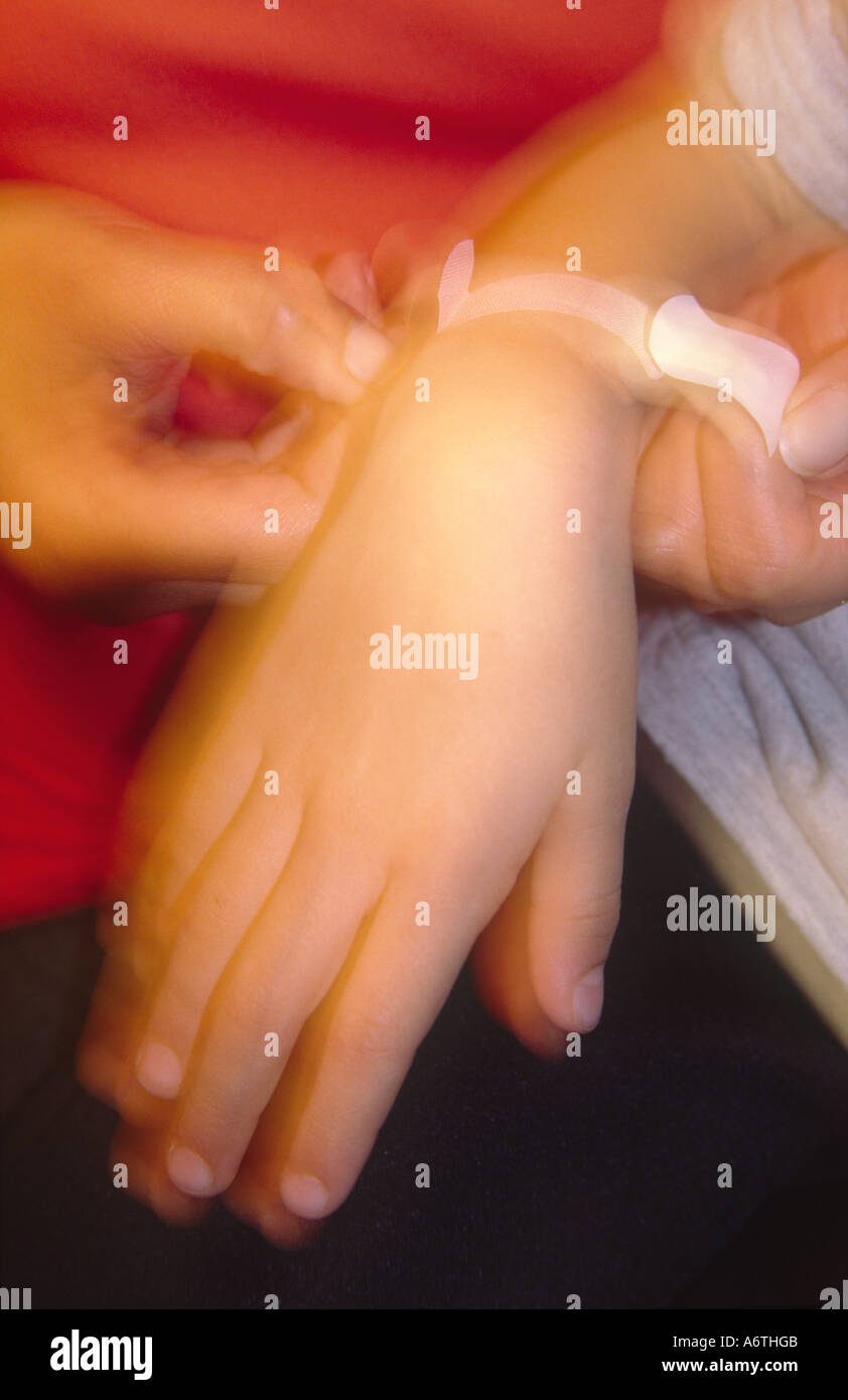Putting plaster on child hi-res stock photography and images - Alamy