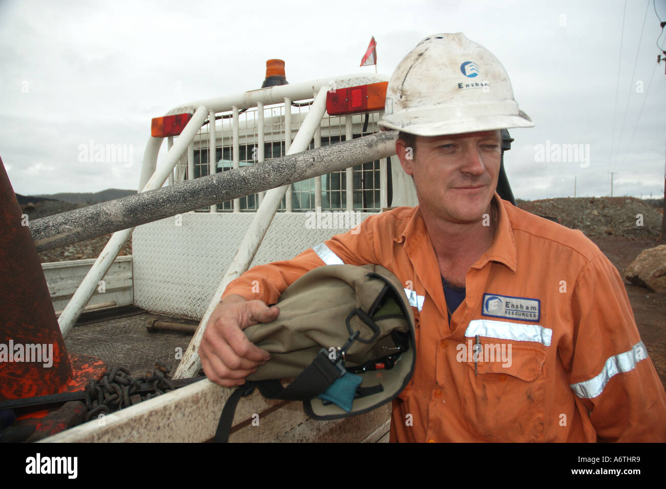 Mine engineer worker leaning on his vehicle Stock Photo - Alamy