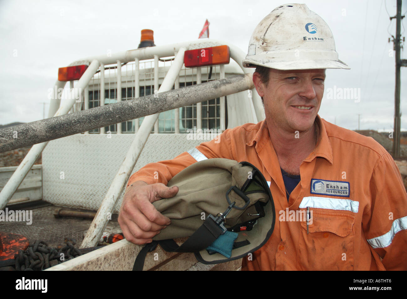 Mine engineer worker leaning on his vehicle Stock Photo - Alamy