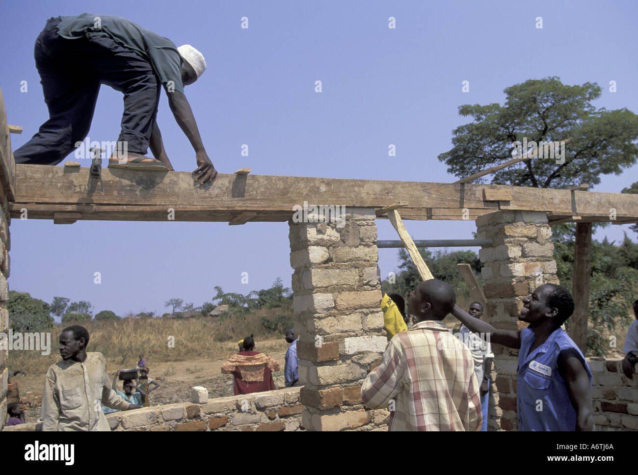 Africa, Tanzania, rural western Tanzania. Construction workers build a ...