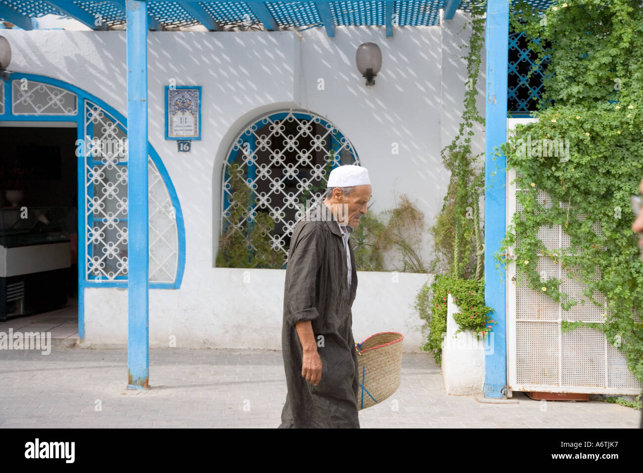 Tunisian Man in Traditional Dress in Market Place Tunisia Djerba Houmt ...