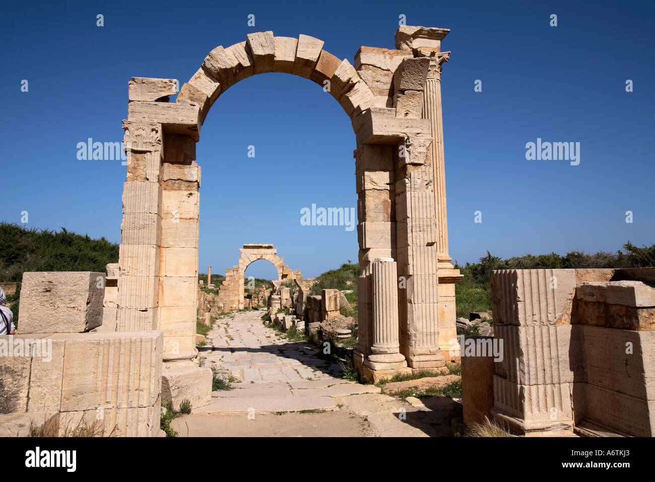 The Arch of Trajan on Via Trionfale at Leptis Magna in Libya with the ...