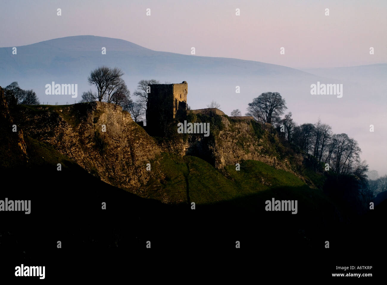Early morning mist around Peveril Castle which lords it over the ...