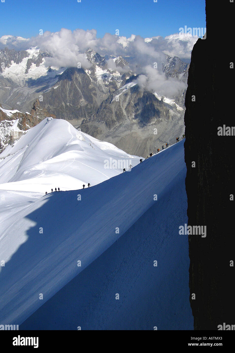 Hikers up Aiguille du Midi Mont Blanc French Alps Stock Photo - Alamy
