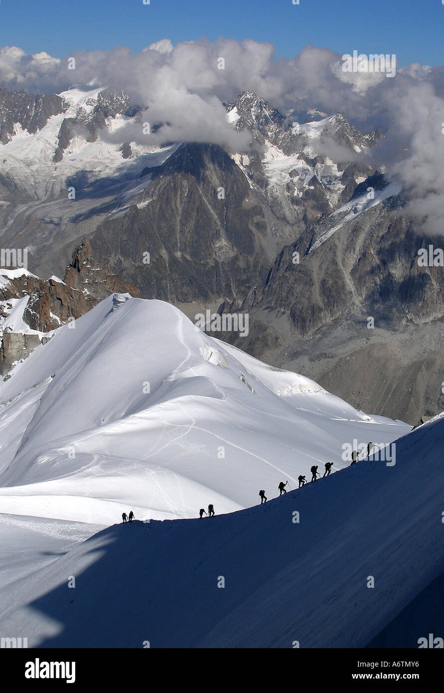 Hikers up Aiguille du Midi Mont Blanc French Alps Stock Photo - Alamy