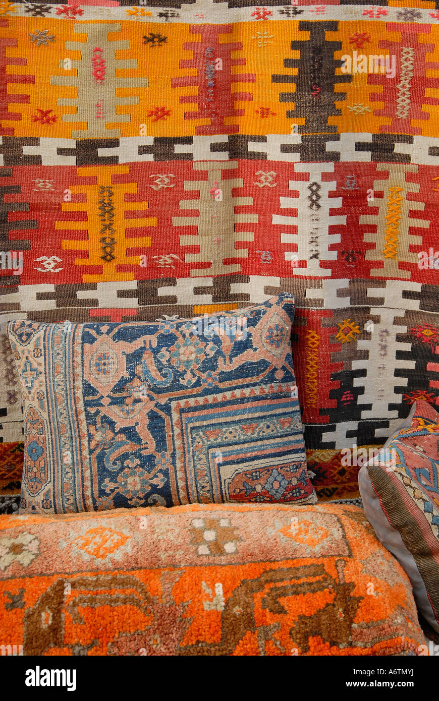 Richly coloured traditional fabric for sale at the market in a bazaar ...
