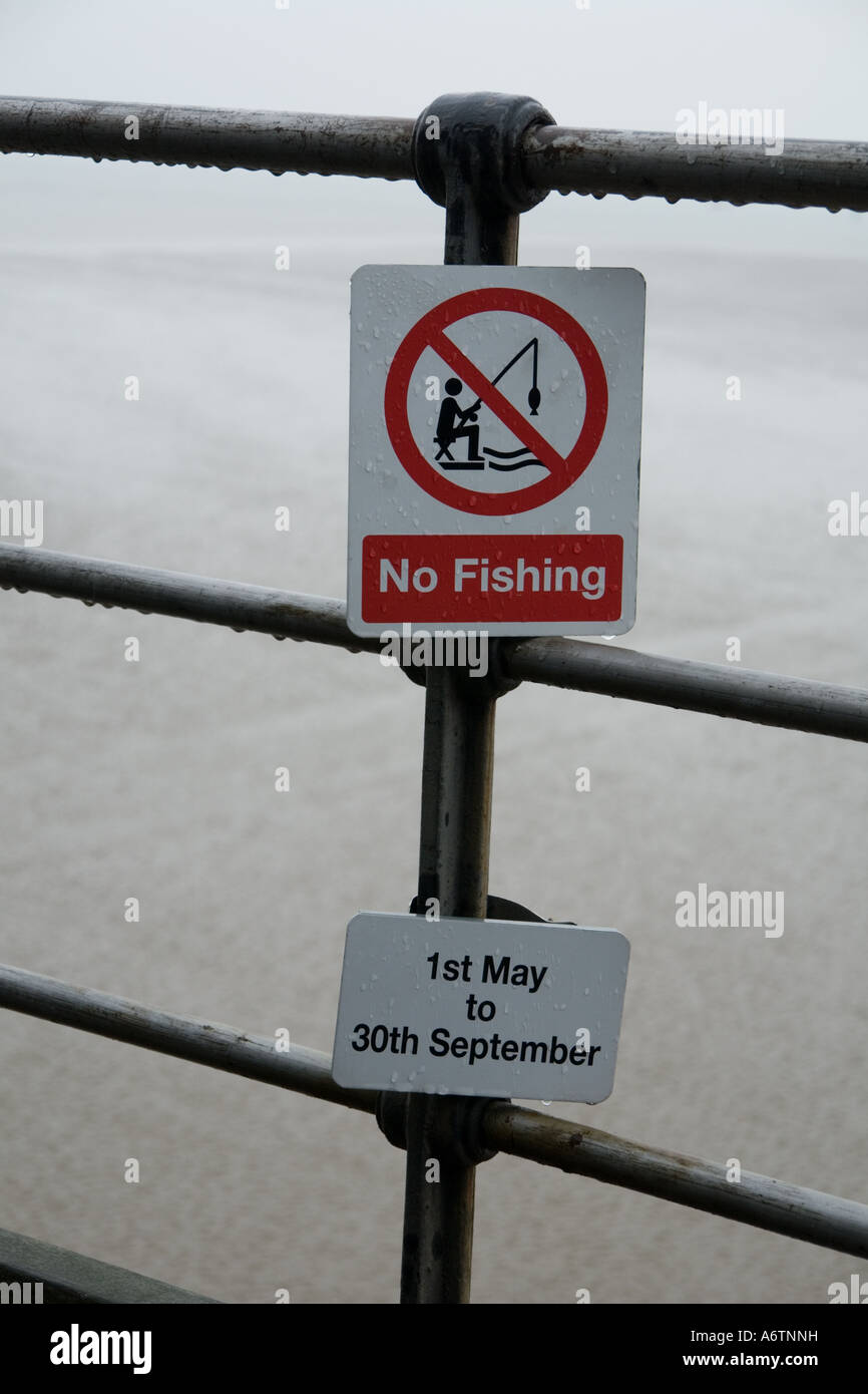 No fishing sign in the rain on Southend pier Stock Photo - Alamy