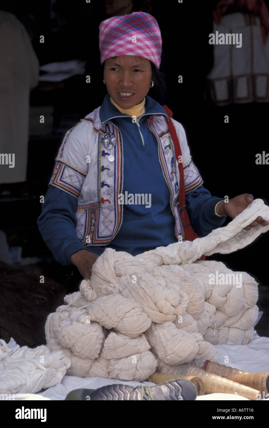 China, Yunnan Province. Hani minority woman in traditional costume ...