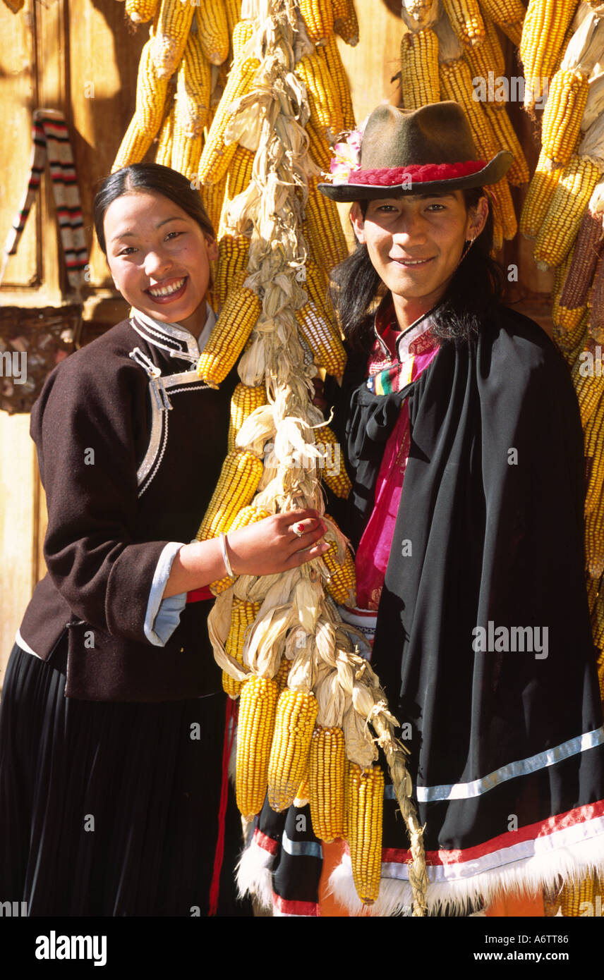 China, Yunnan, Kunming. Young Mosu couple in traditional costume pose ...