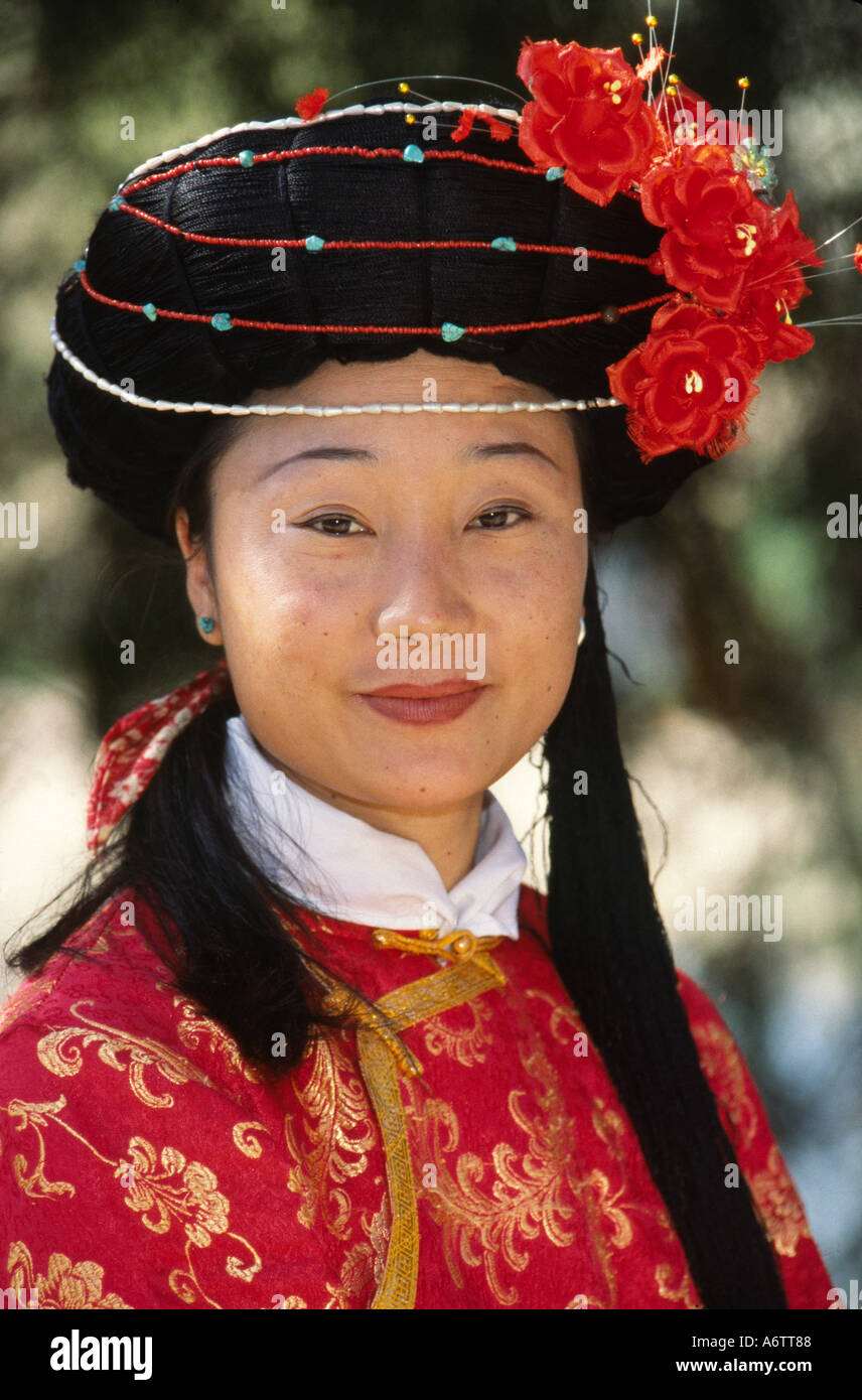 China, Yunnan, Kunming. Young Mosu minority woman in traditional ...