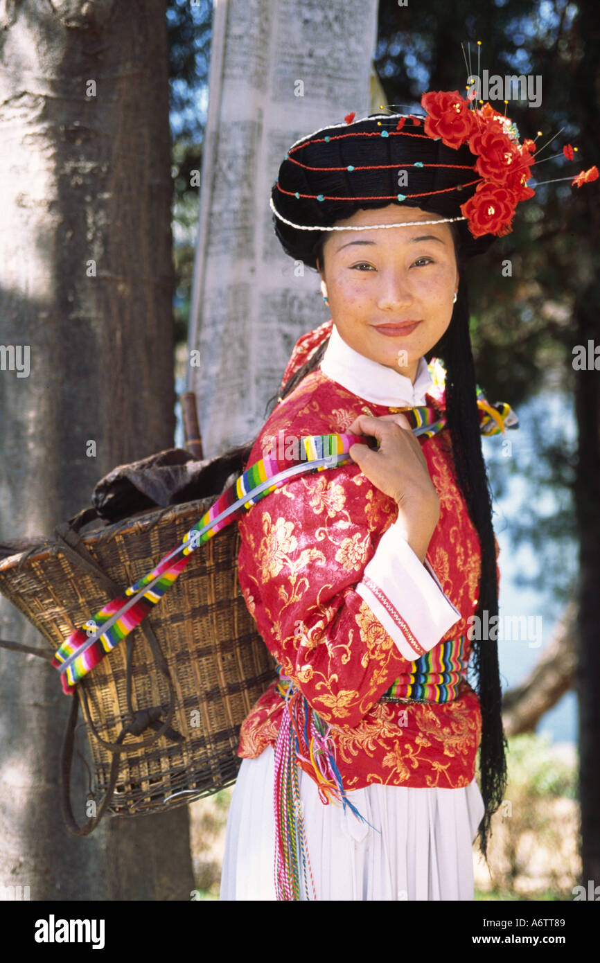 China, Yunnan, Kunming. Young Mosu minority woman in traditional ...