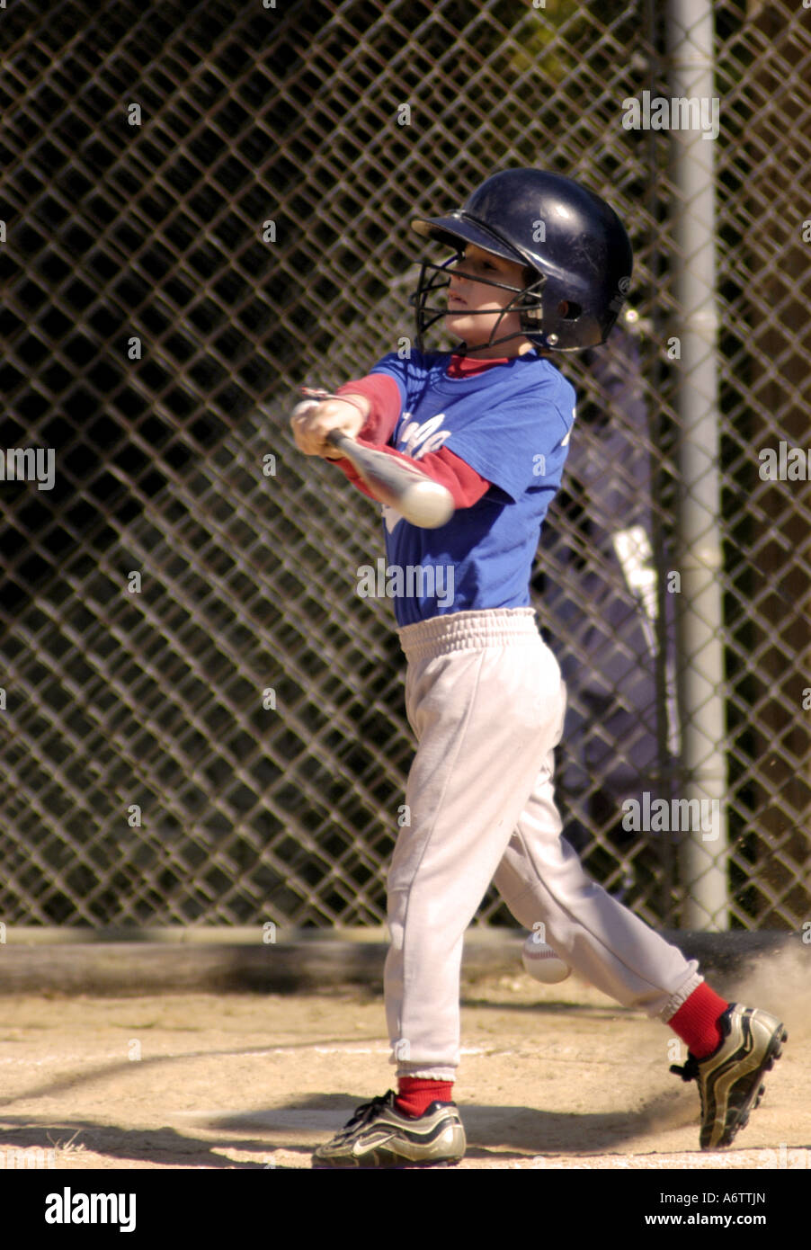 Baseball boy swings bat strikes out Stock Photo - Alamy