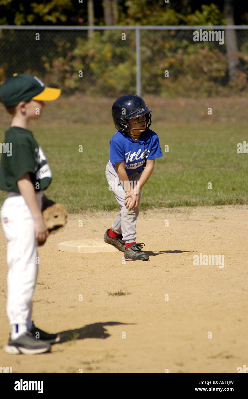 Boys age 6 7 playing little league baseball Stock Photo - Alamy