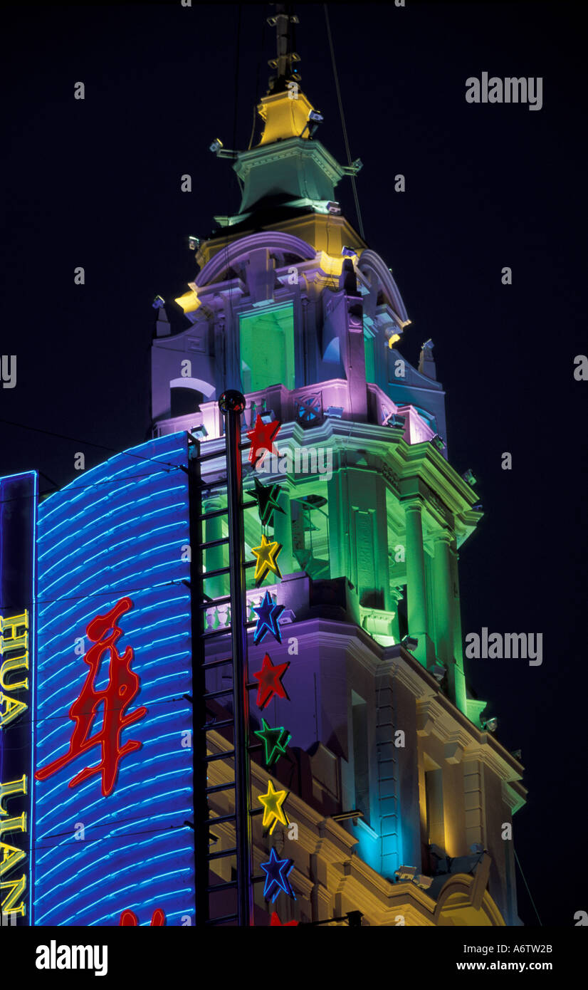 China, Shanghai. Lit buildings and neon sign; Nanjing Dong Lu ...