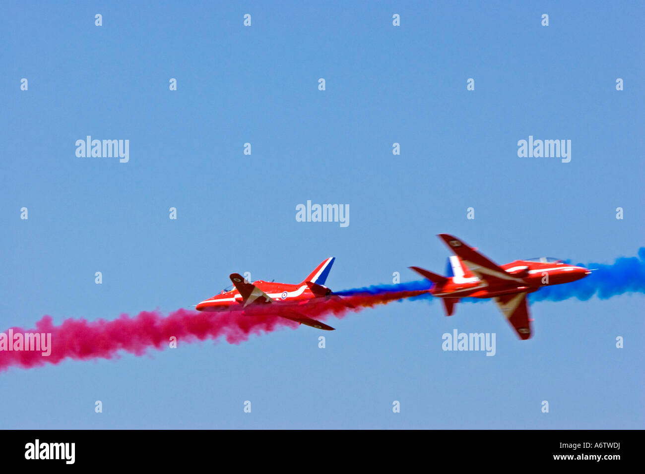 RAF Red Arrows Aerobatic Team perform their famous cross-over manoeuvre ...
