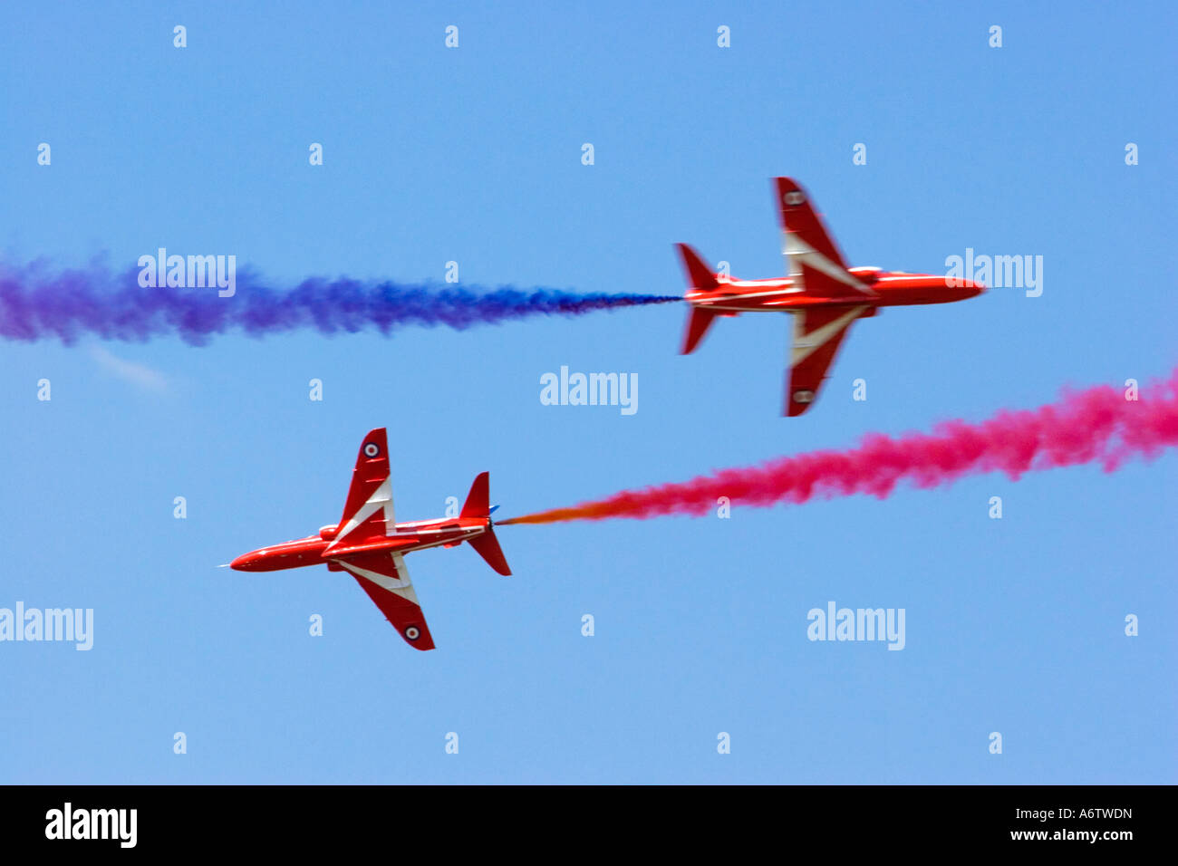 RAF Red Arrows Aerobatic Team perform their famous cross-over manoeuvre ...