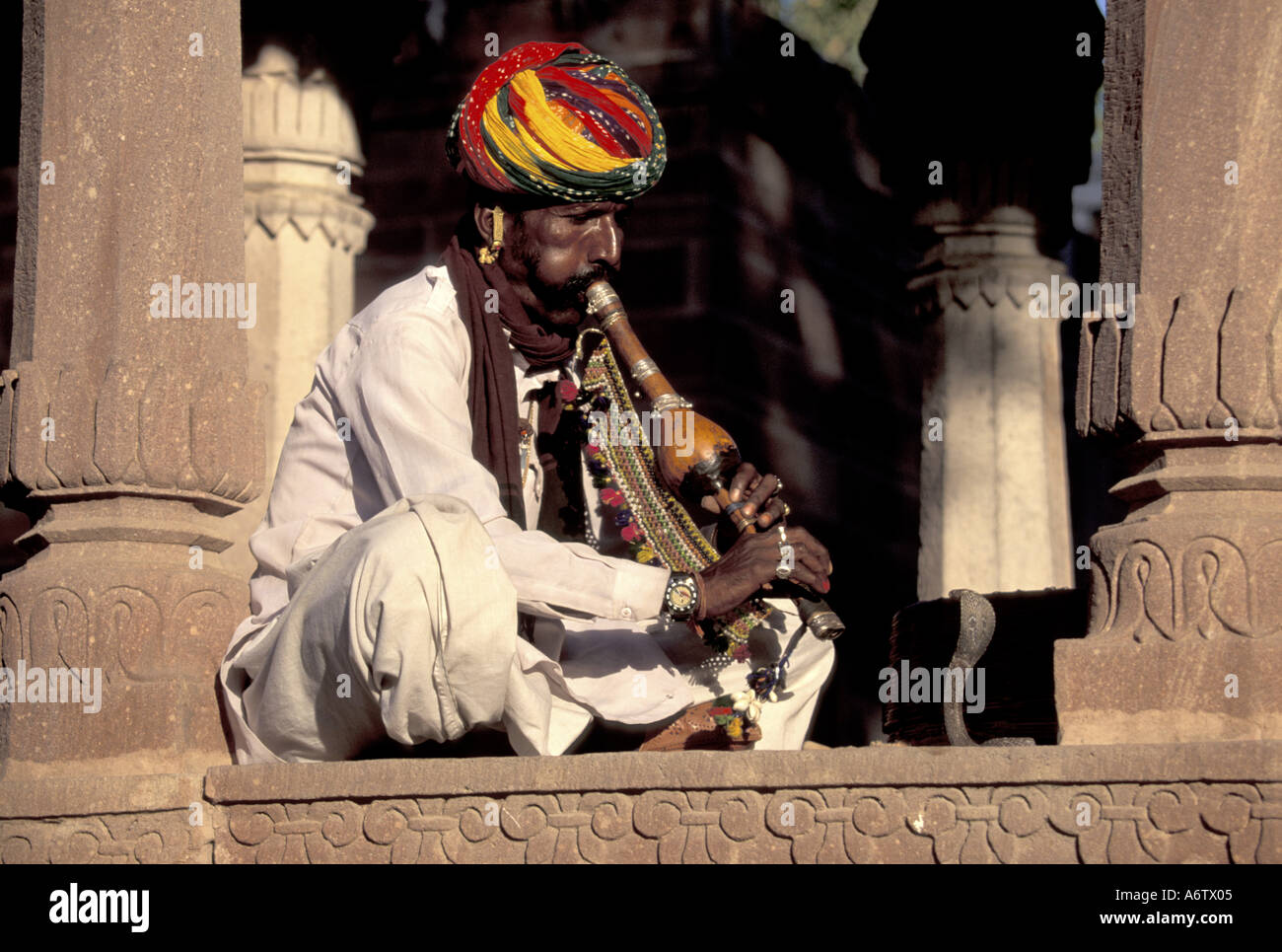 India, Rajasthan, Jodhpur, Snake charmer and snake, Gardens of Mandor ...