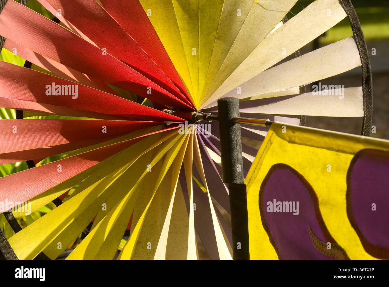 Weather wind vane bright colors red yellow and white Stock Photo - Alamy