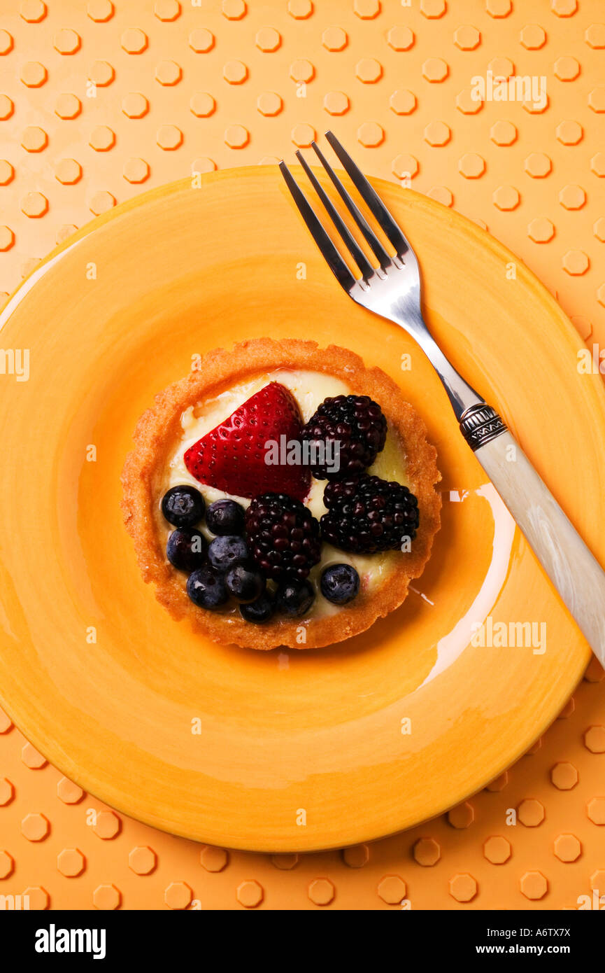 Tart on yellow plate Stock Photo - Alamy