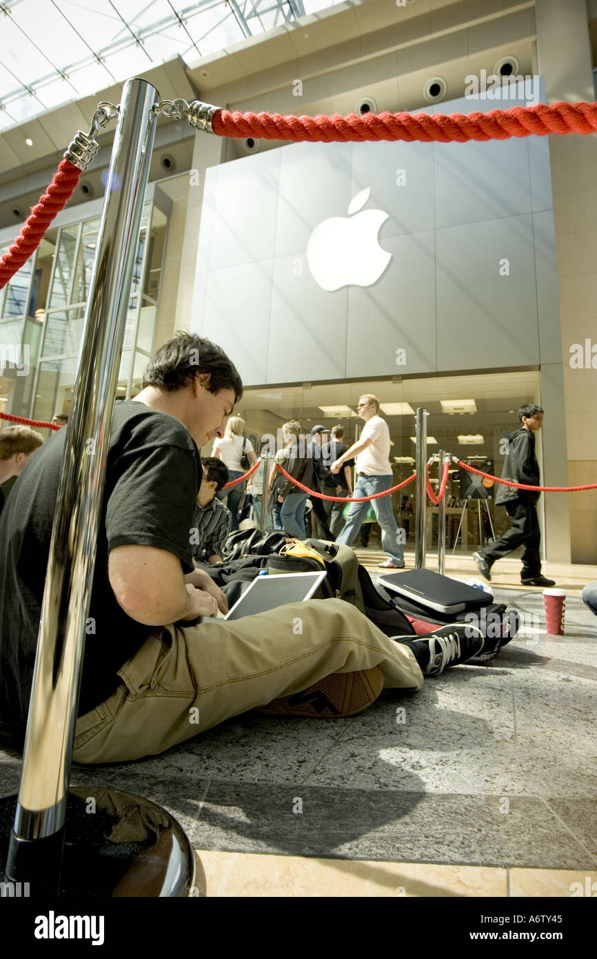Man camping out waiting for the new Apple store to open at the ...