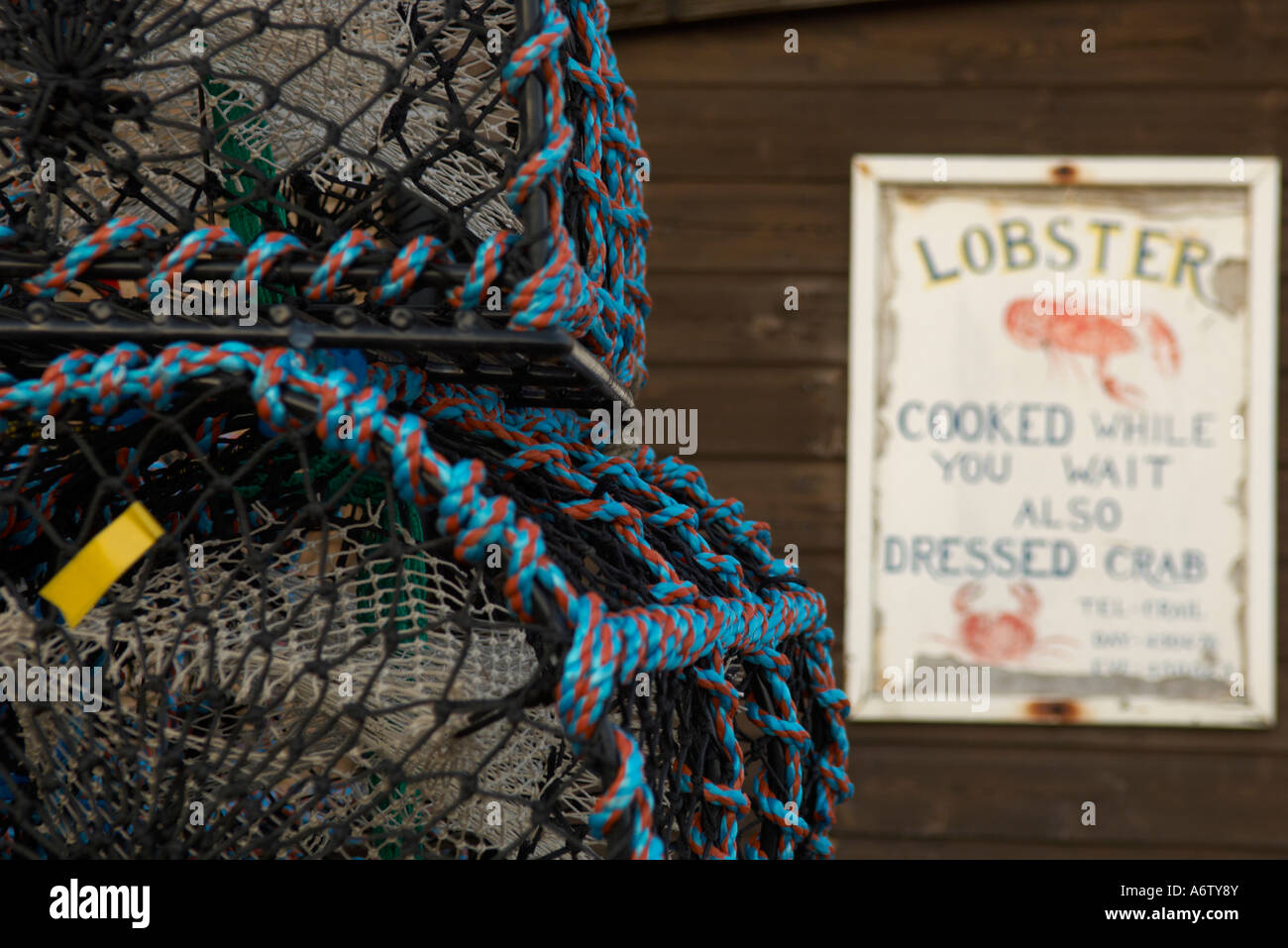 Lobster creels and old fashioned take away sign Crail Scotland Stock ...