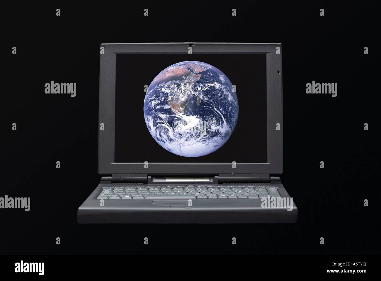 Laptop Computer with Planet Earth Displayed on the Screen Against a ...